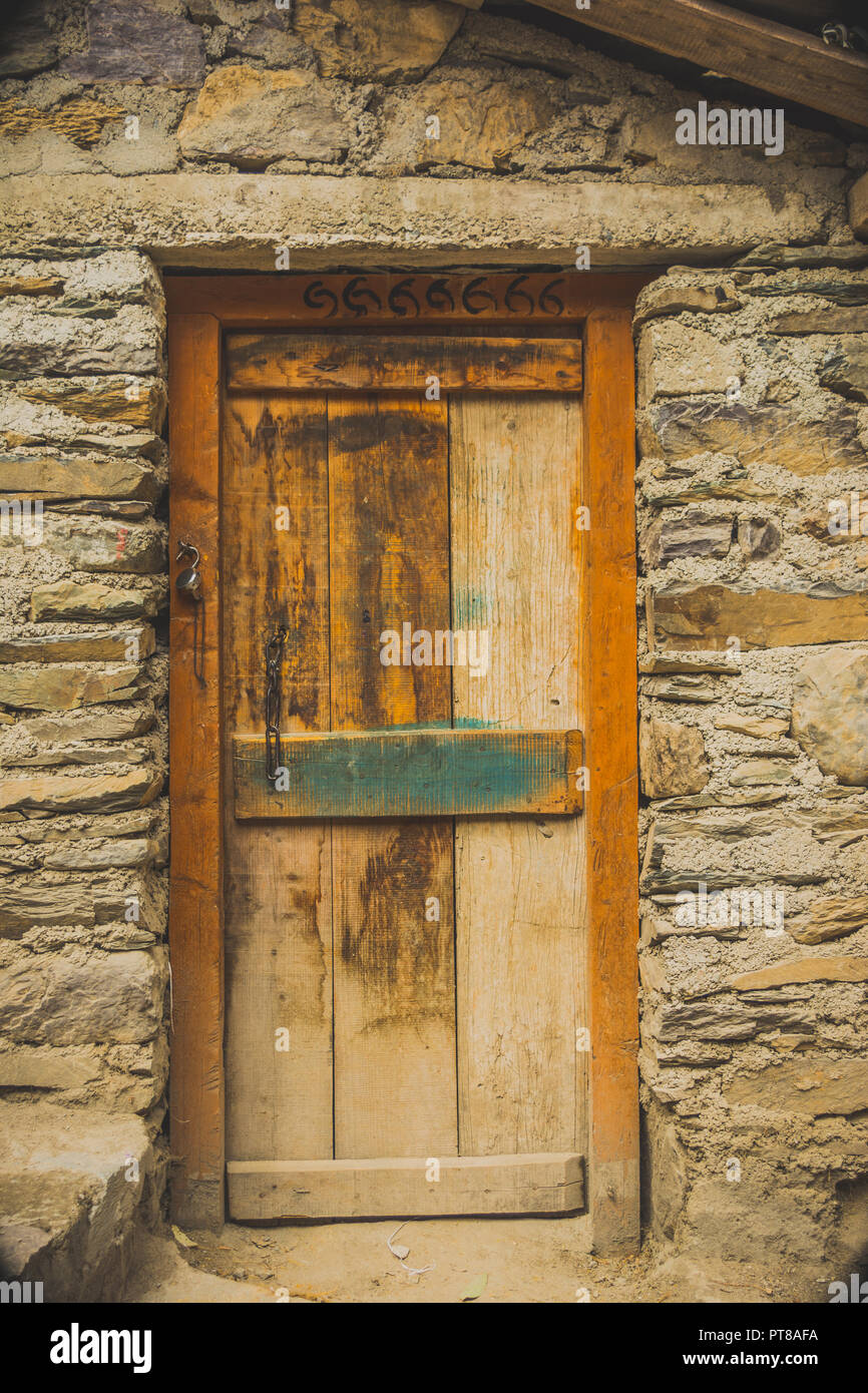 Photo of a wooden door of an abandoned, rickety house, and a broken ...