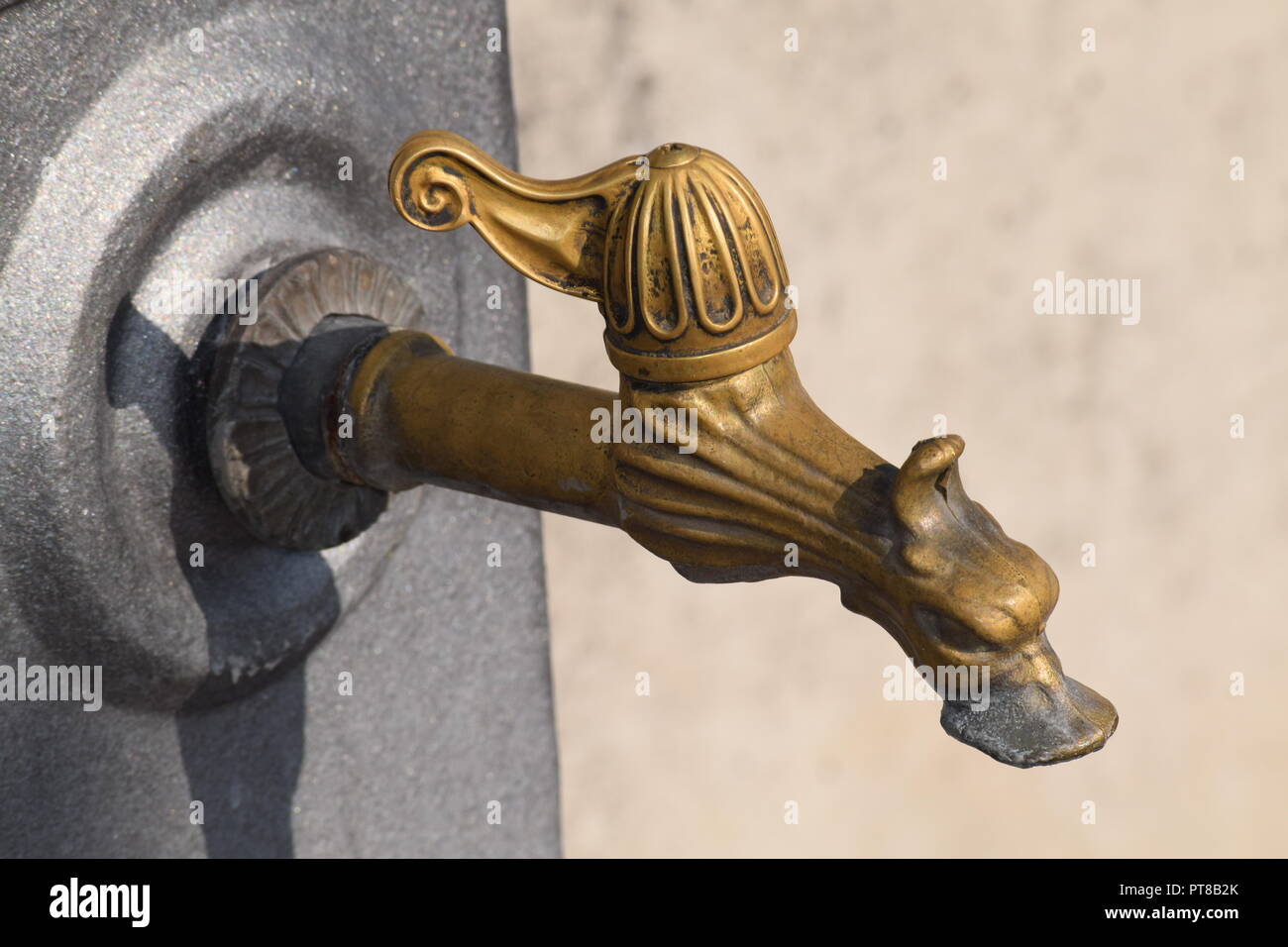 Ornate water tap, lakeside in Argegno, Lake Como, Italy Stock Photo - Alamy