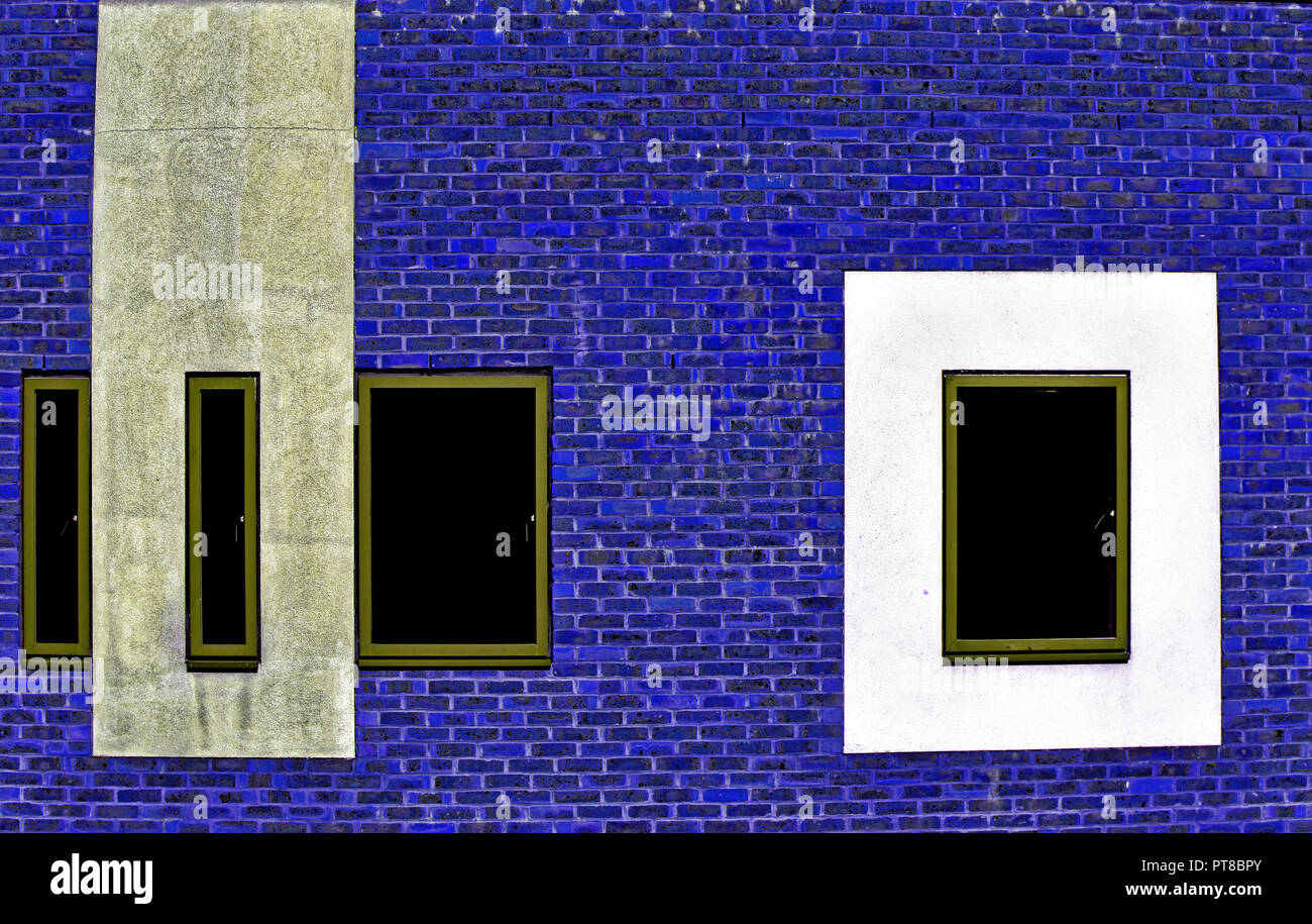 Red brick building with odd shaped windows Stock Photo - Alamy