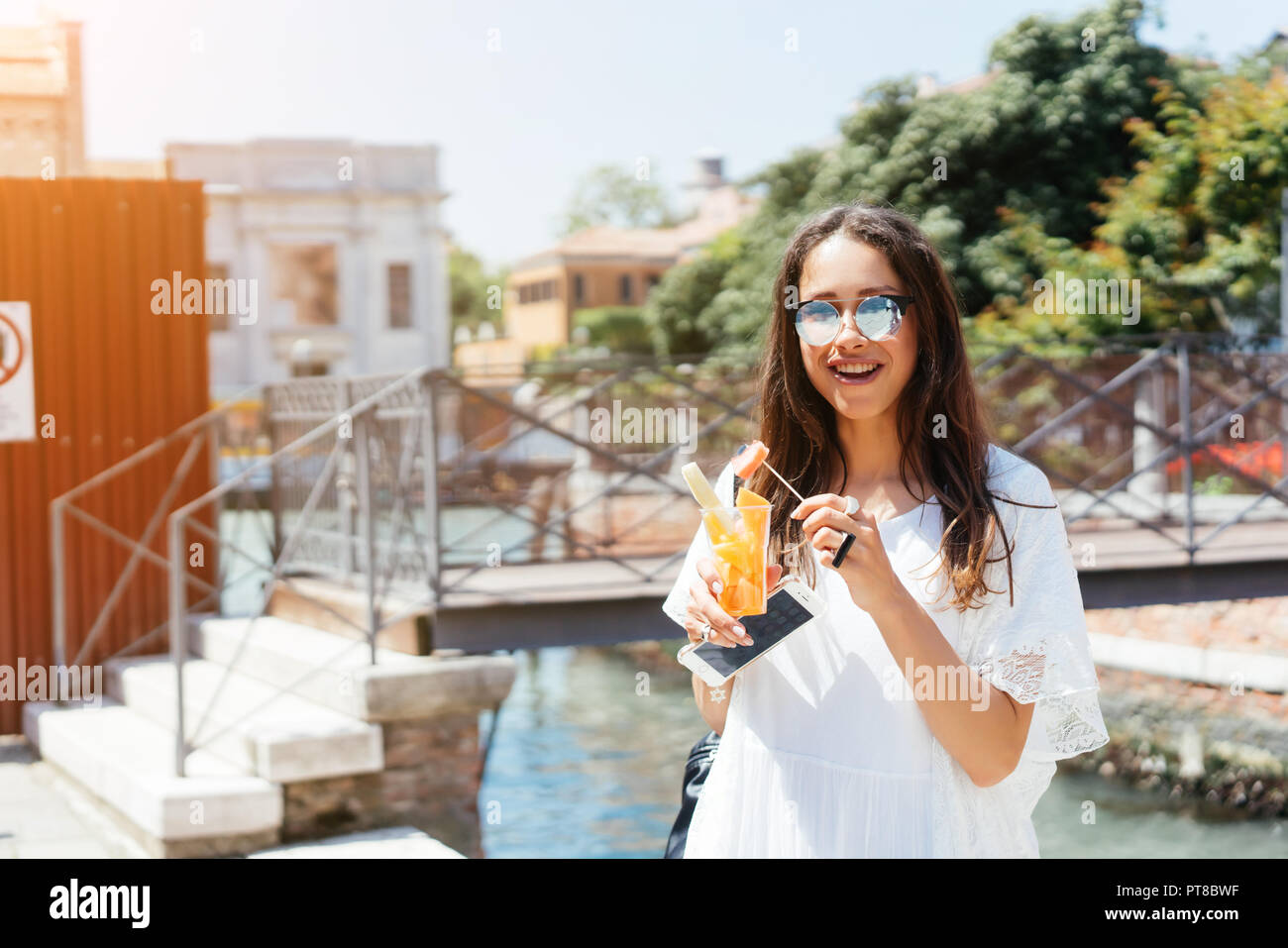 Beautiful young woman eating healthy food on travel vacation Stock ...