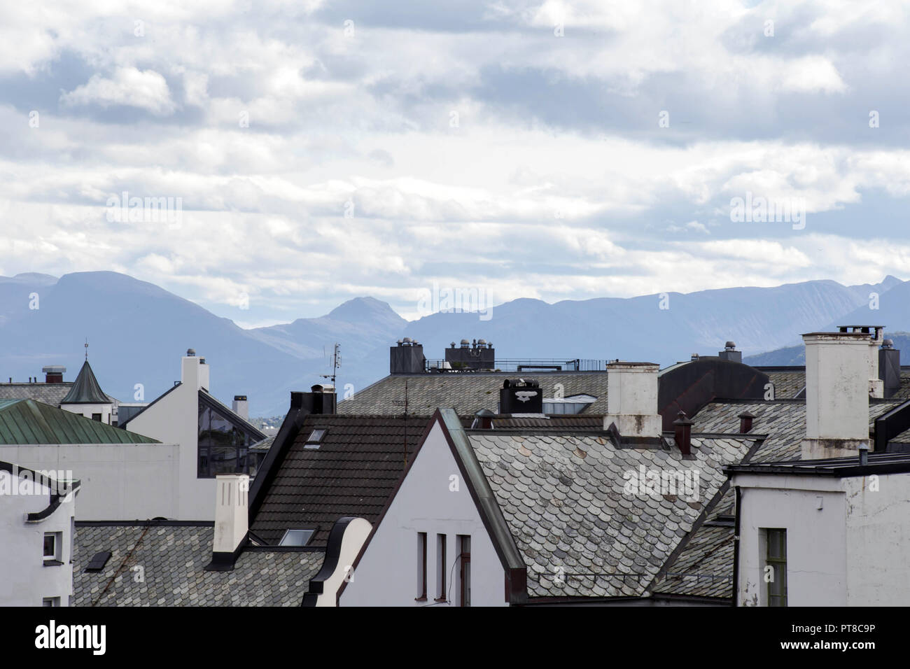 Old historical city close-up, grey rooftops with blue sky Stock Photo ...