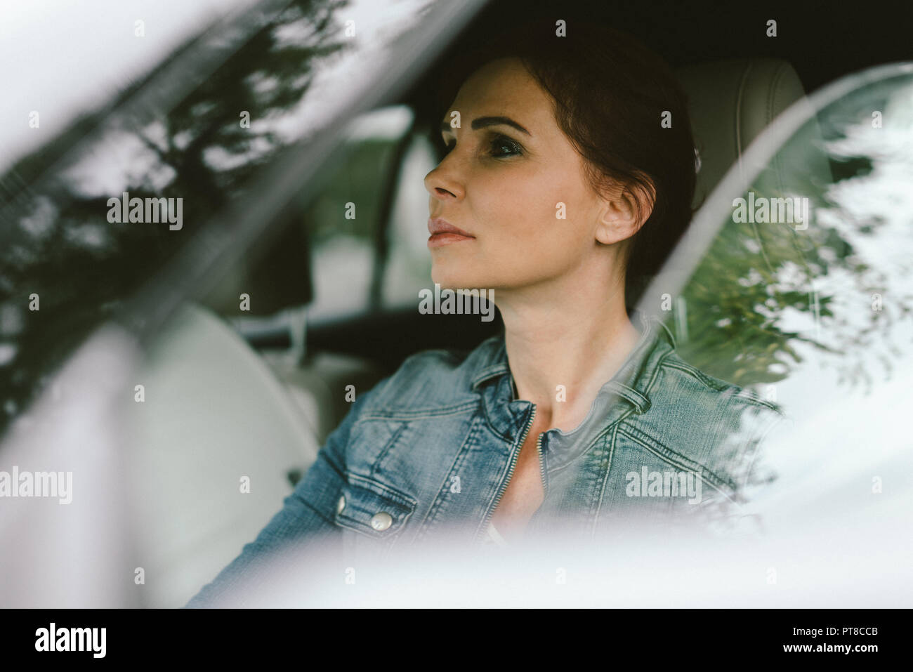 Woman driving car Stock Photo - Alamy
