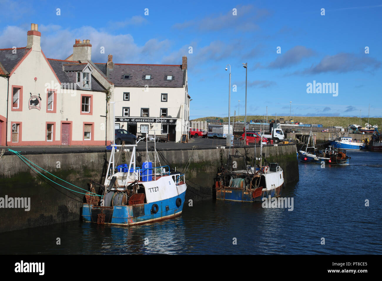 View of fishing boats in Eyemouth Harbor, Borders Region, Scotland with ...