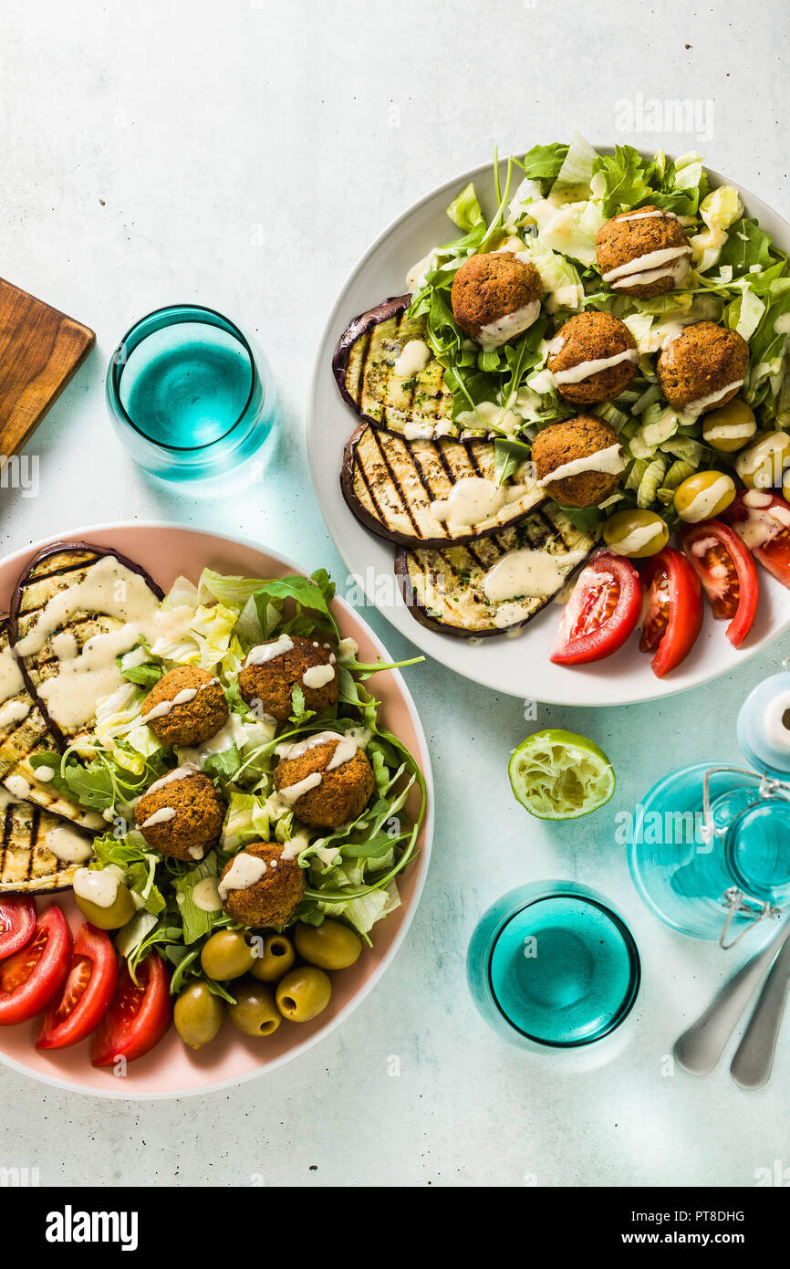 an appetizing dinner or lunch from a salad with tomatoes, grilled ...