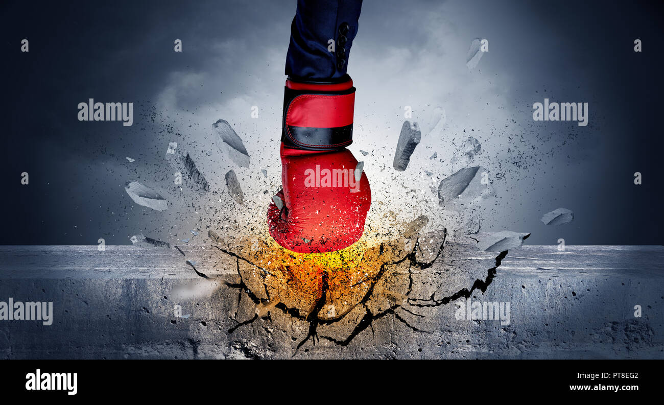 Big hand hits intense and breaks a crass stonewall Stock Photo - Alamy