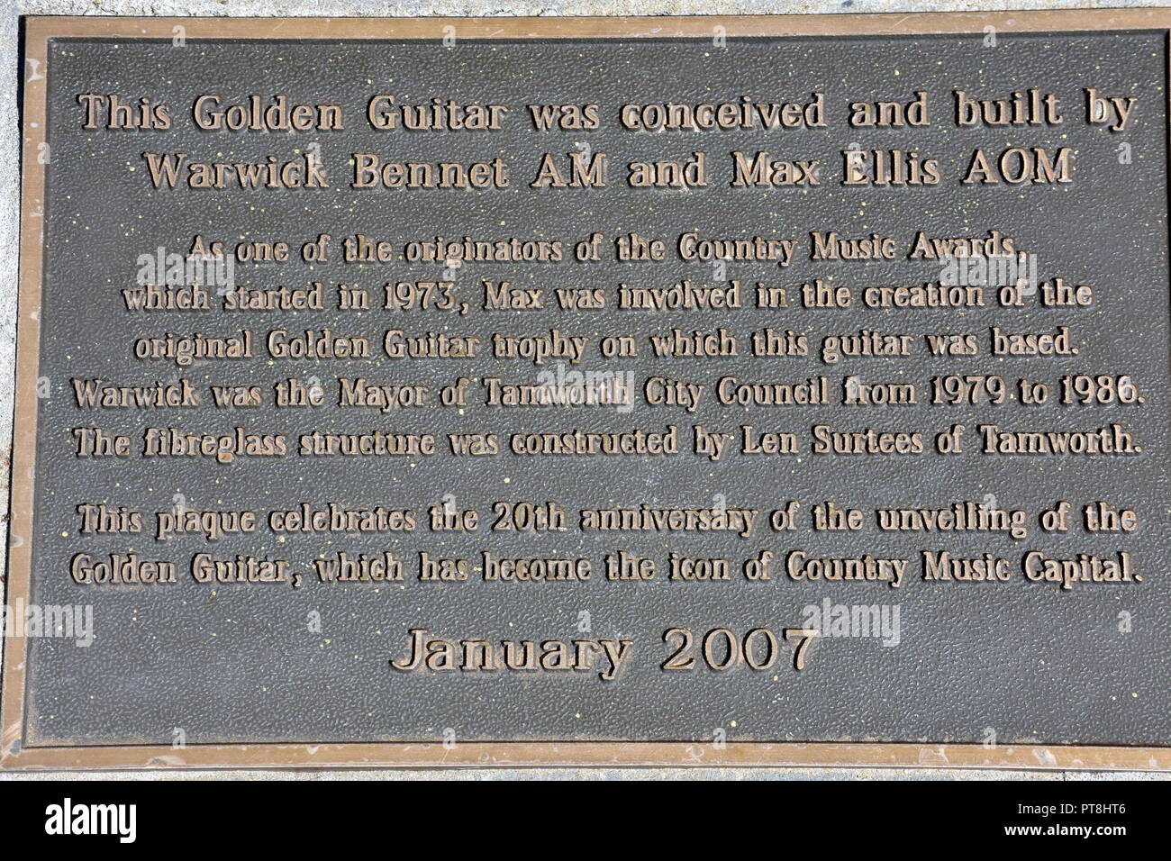 Golden guitar plaque Stock Photo - Alamy