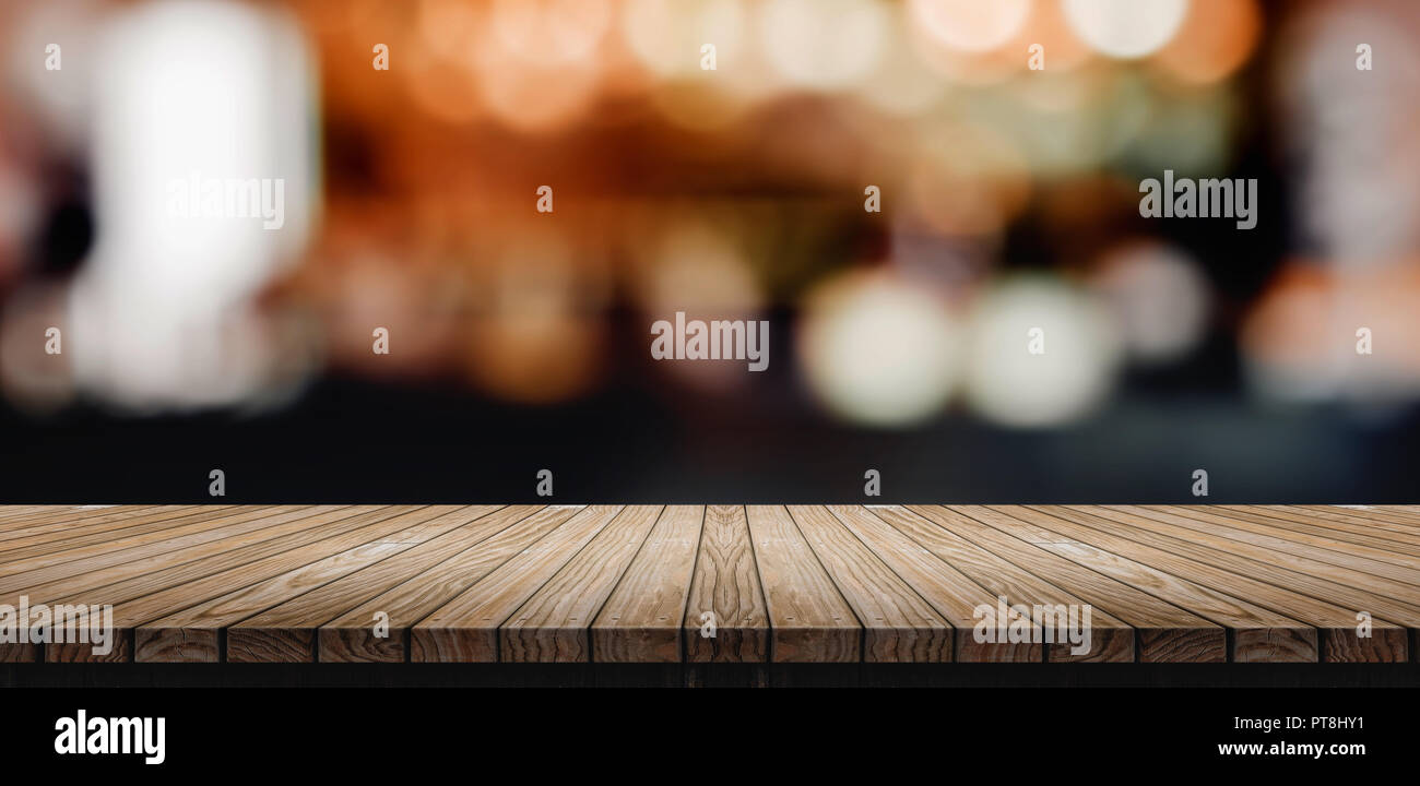 Plank Wood table top with blur nightclub bar counter with bokeh light ...