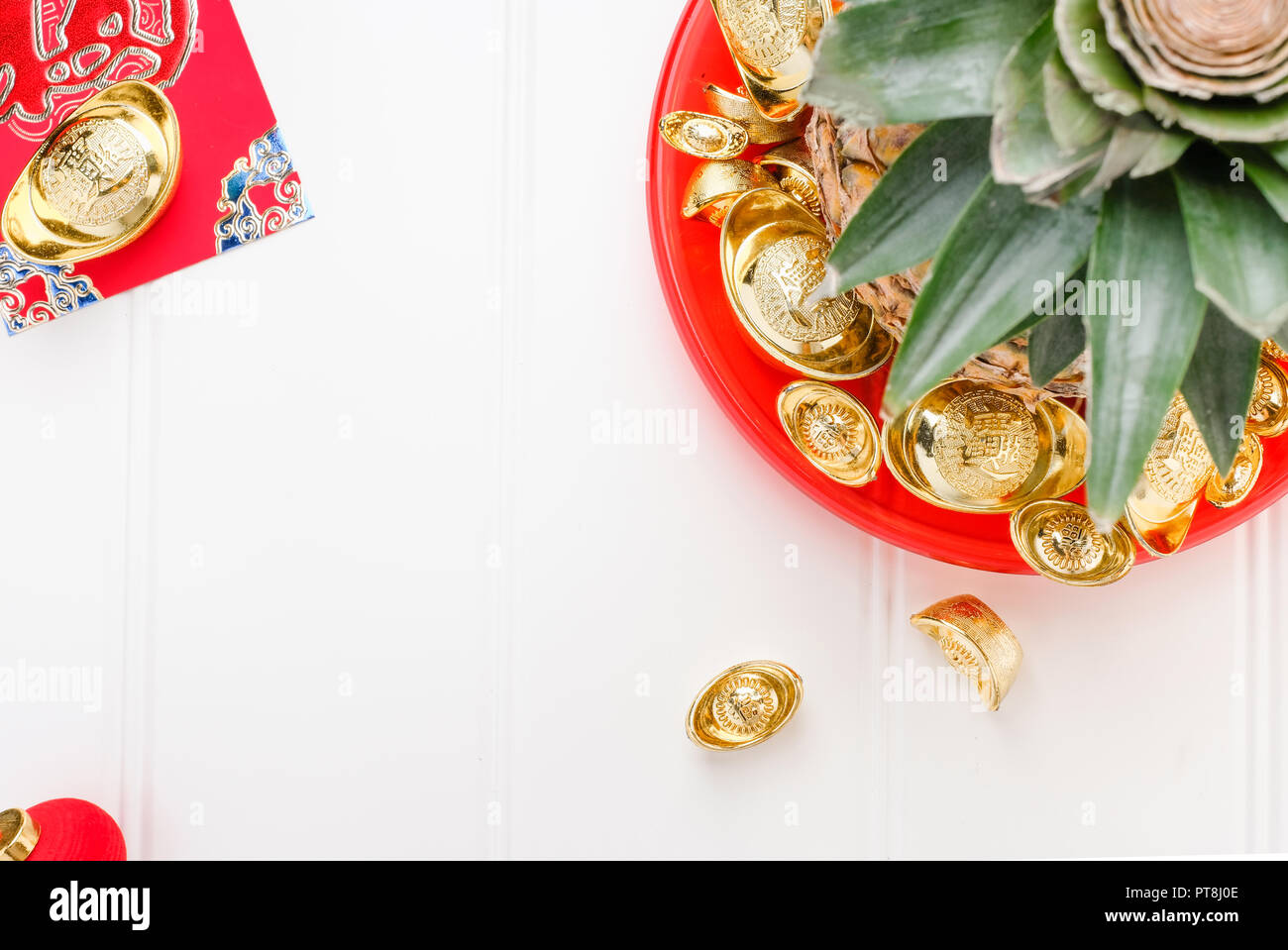 Chinese New year ang pow concept.Top view Pineapple with group of gold ...