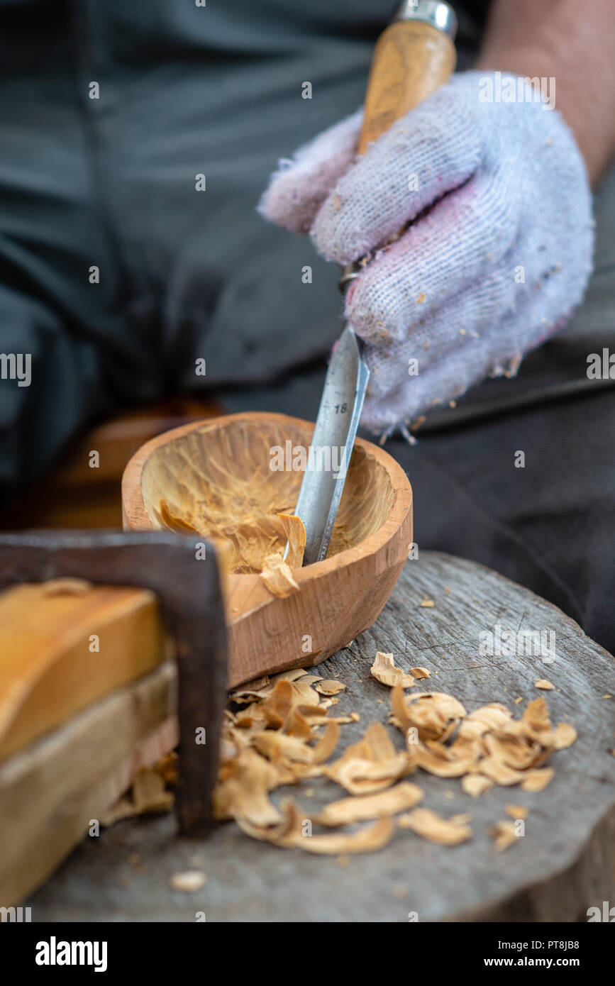 Craftsman demonstrates the process of making wooden spoons handmade ...