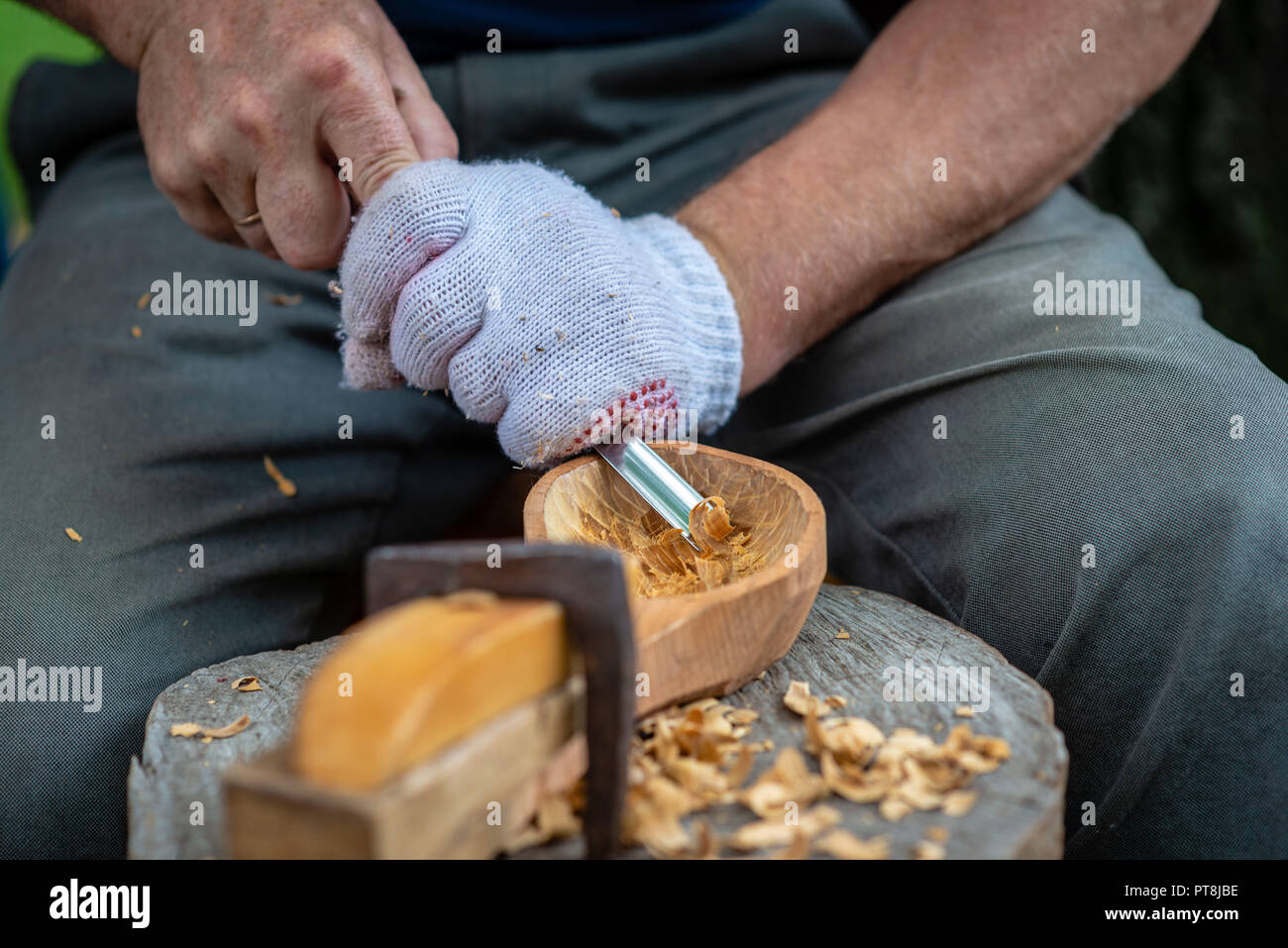 Craftsman demonstrates the process of making wooden spoons handmade ...