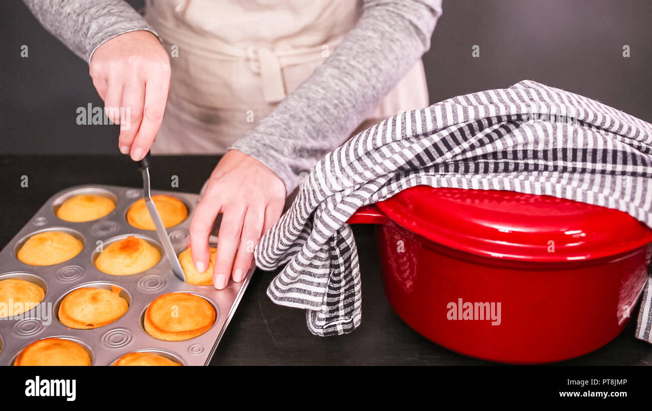Step by step. Removing freshly baked cornbread muffins from metal ...