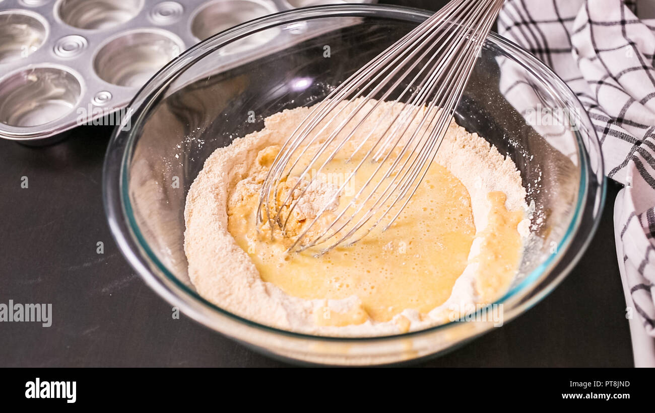 Step by step. Baking cornbread muffins in metal muffin tin Stock Photo ...