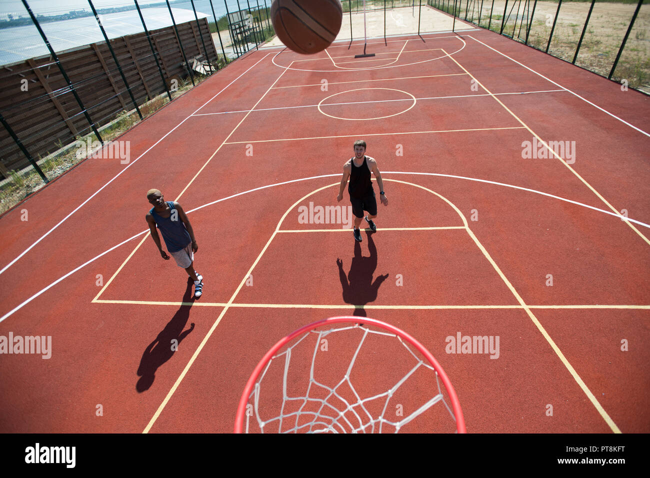 Full length high angle view portrait of two young men playing ...