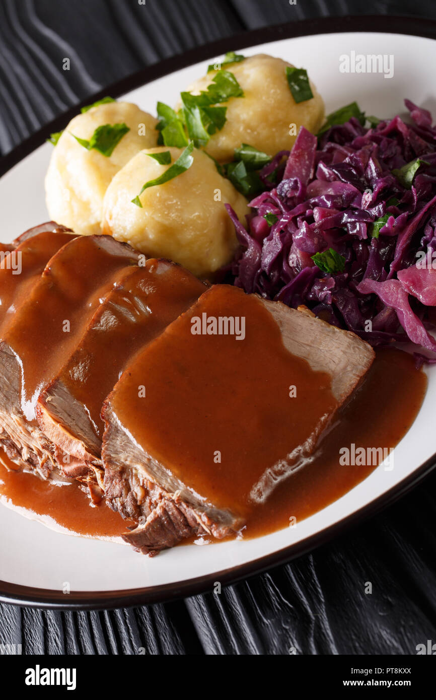 German national dish Sauerbraten served with knodel potato dumplings ...