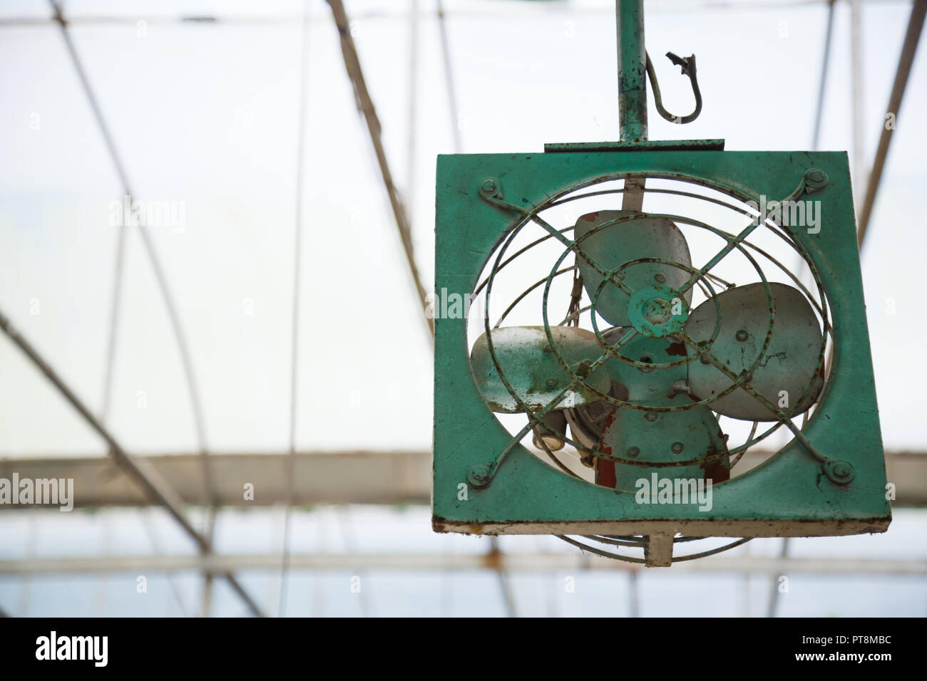 old aged vintage retro rustic green indoor ceiling mechanical metal fan ...