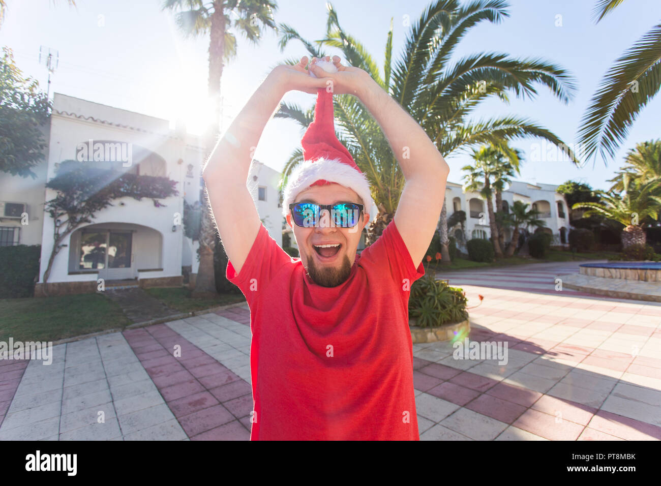 Christmas, holidays, humor, people concept - man take off the christmas ...