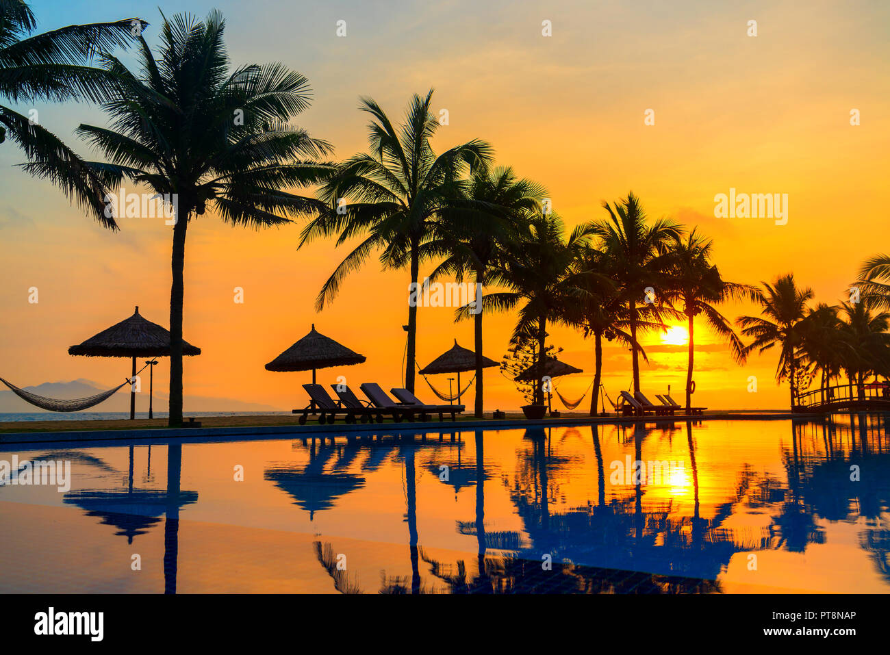 Amazing Sunset at the tropical beach Stock Photo - Alamy