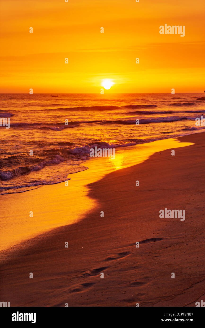 Amazing Sunset at the tropical beach Stock Photo - Alamy