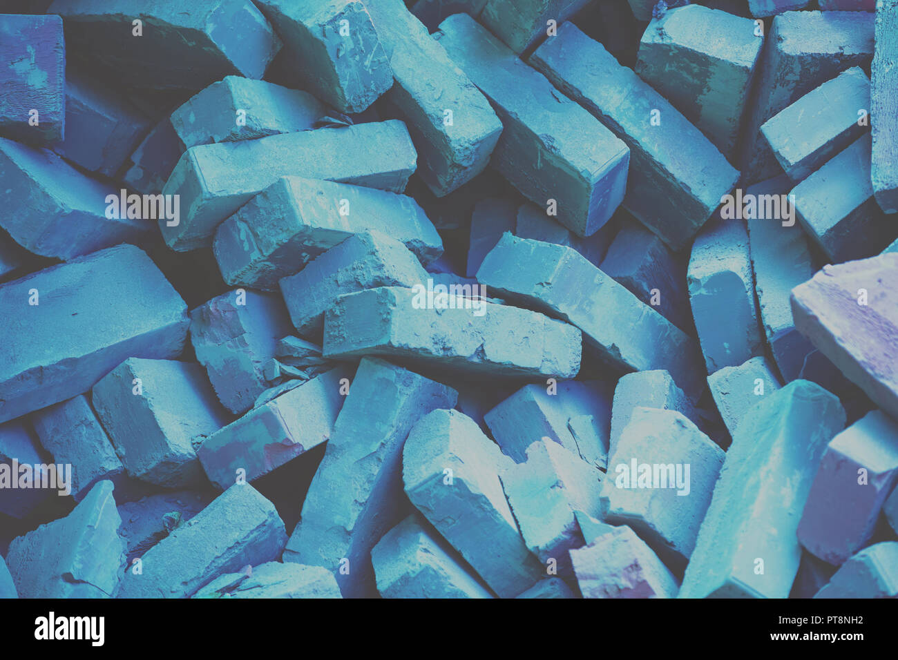 A pile of brick construction background. Blue toned Stock Photo - Alamy