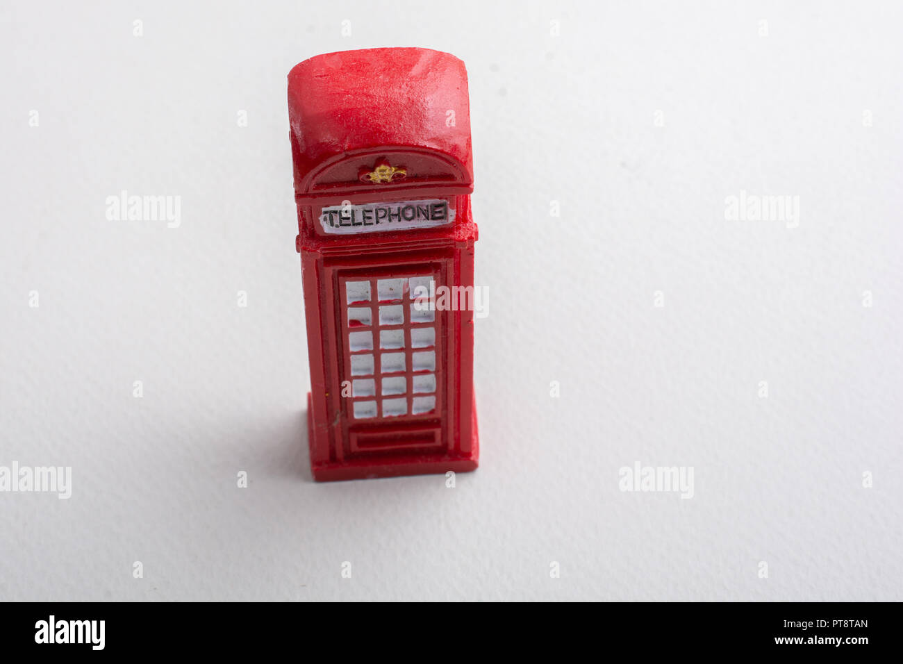 Red color phone booth on a white background Stock Photo - Alamy