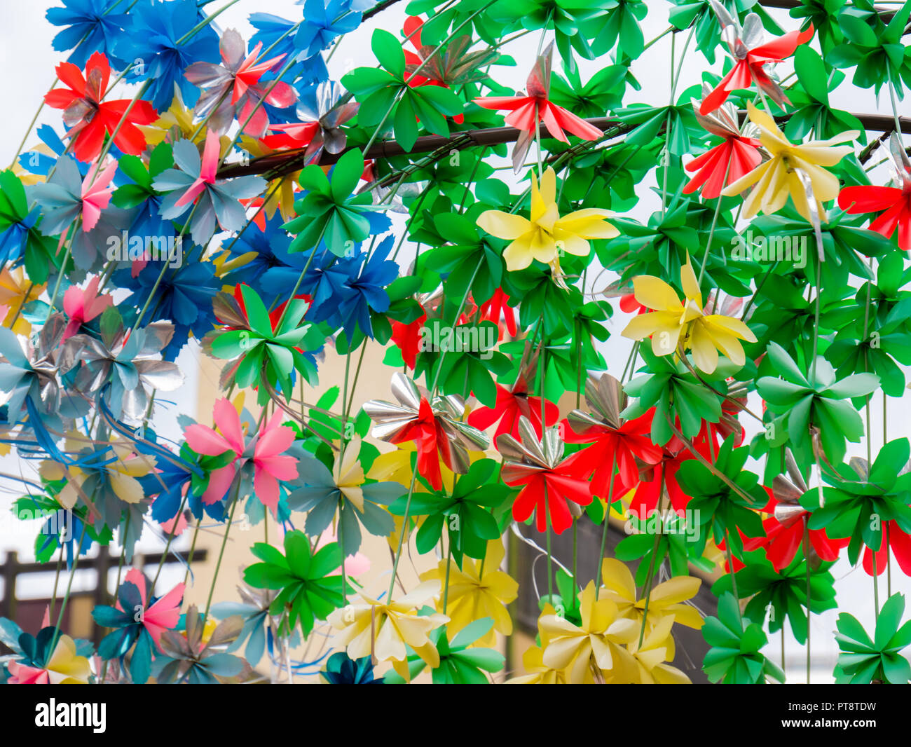 Colorful plastic flower garland texture background Stock Photo - Alamy