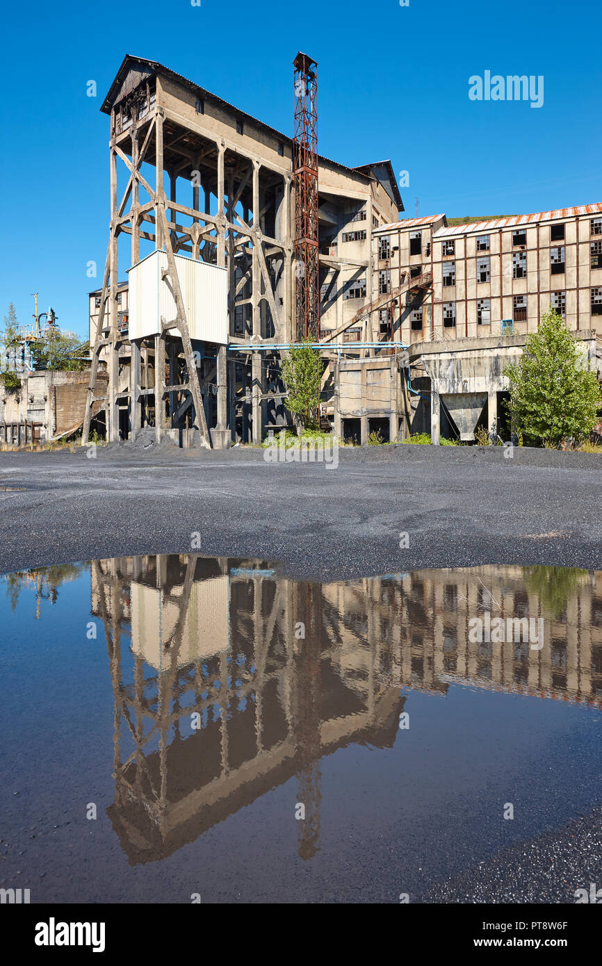 Abandoned coal factory. Industrial rusted machinery. Polluted landscape ...
