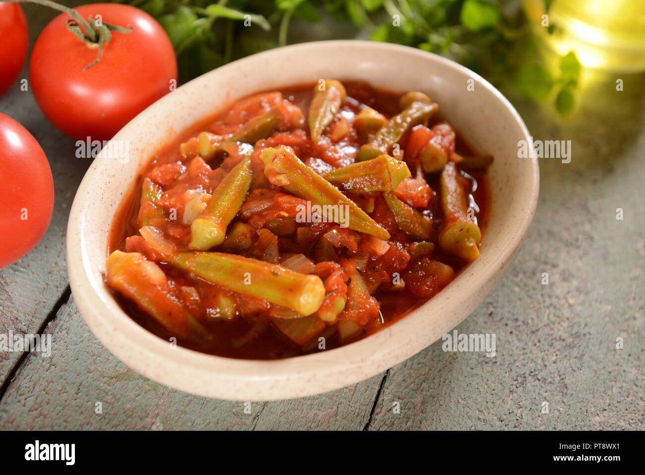 Okra dish with tomatoes (Traditional greek, romanian, bulgarian and ...