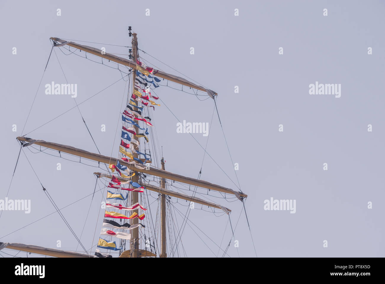 Colorful nautical sailing flags flying in the wind from the lines of a ...