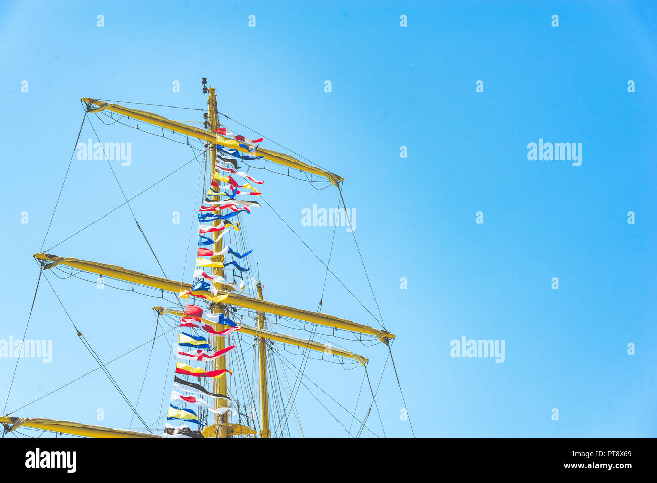 Colorful nautical sailing flags flying in the wind from the lines of a ...