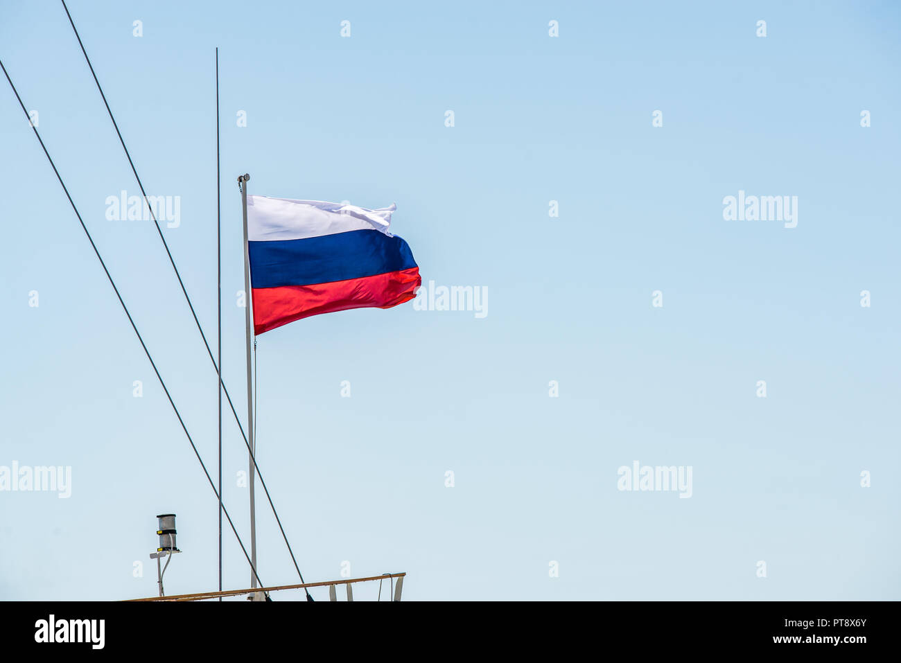 Russian flag on the mast of a boat going on water Stock Photo - Alamy