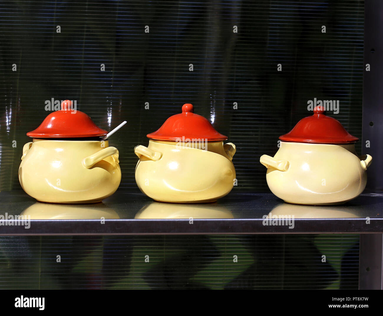 Ceramic pots for baking products on the kitchen shelf Stock Photo - Alamy