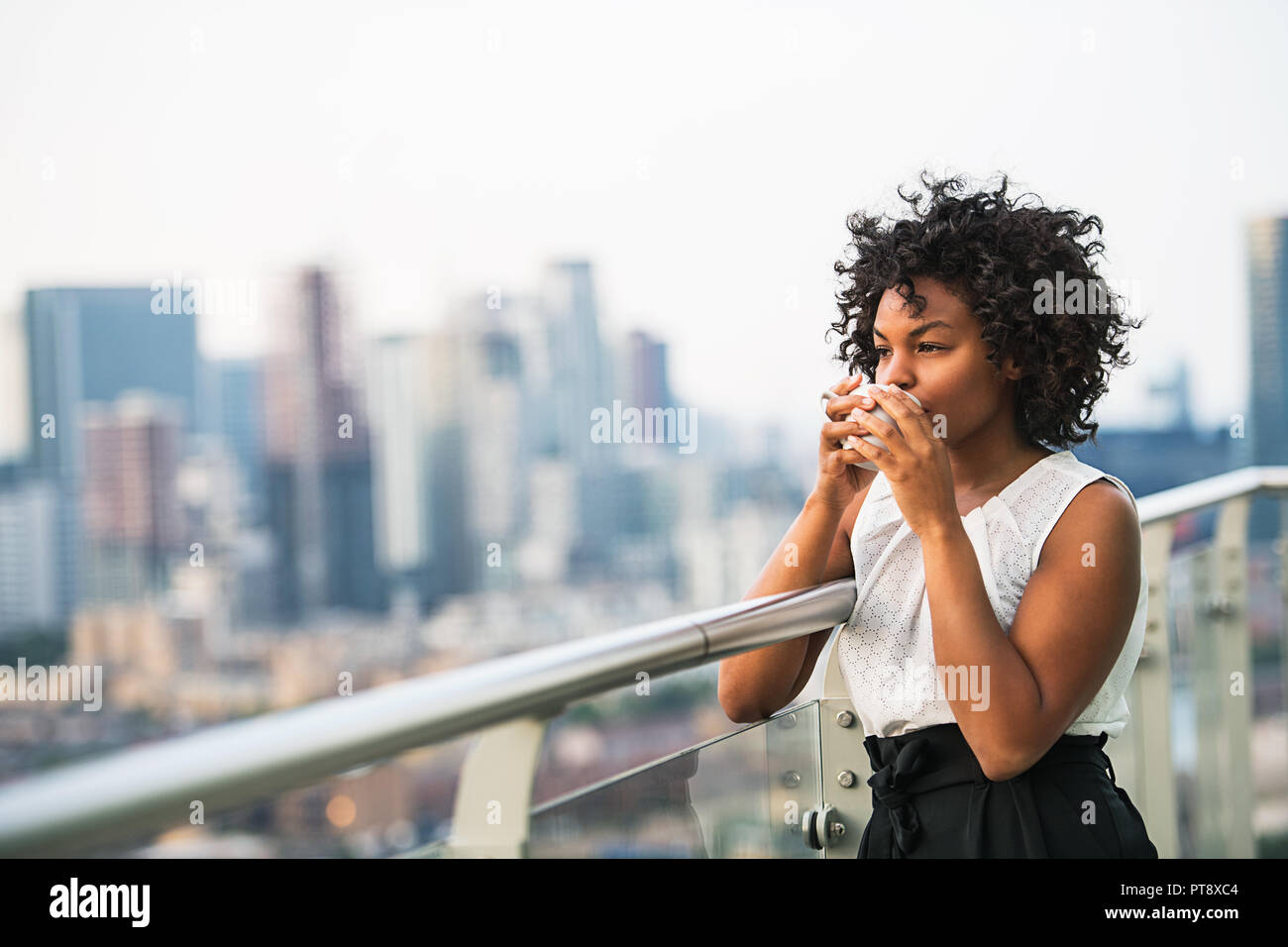 Woman top skyscraper hi-res stock photography and images - Alamy