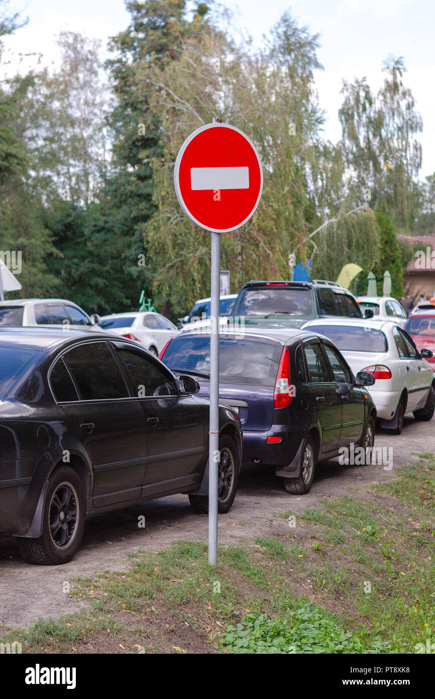 Traffic jam from cars on highway and sign: entry is prohibited ...