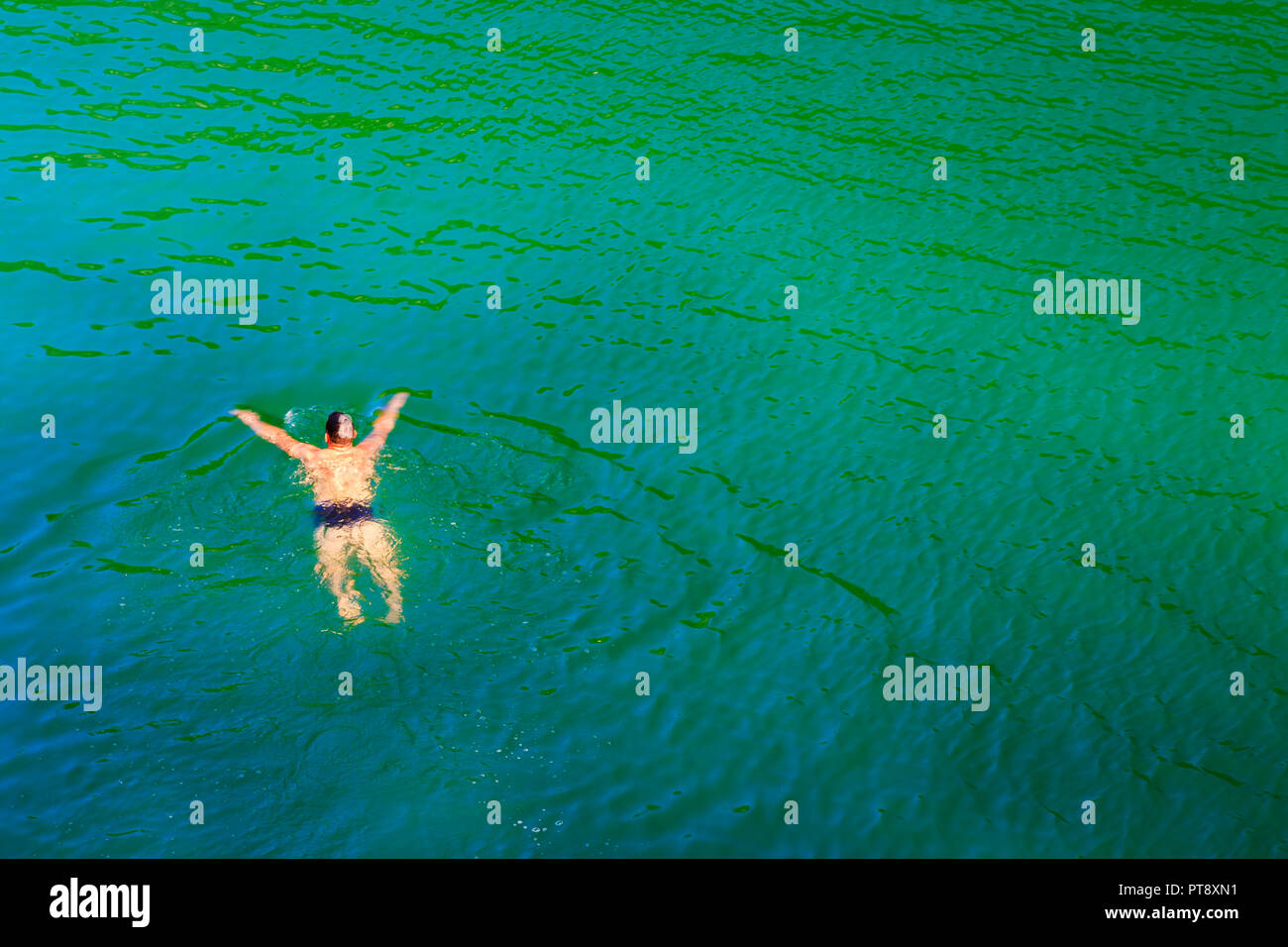 Man floating in outdoor swimming hi-res stock photography and images ...