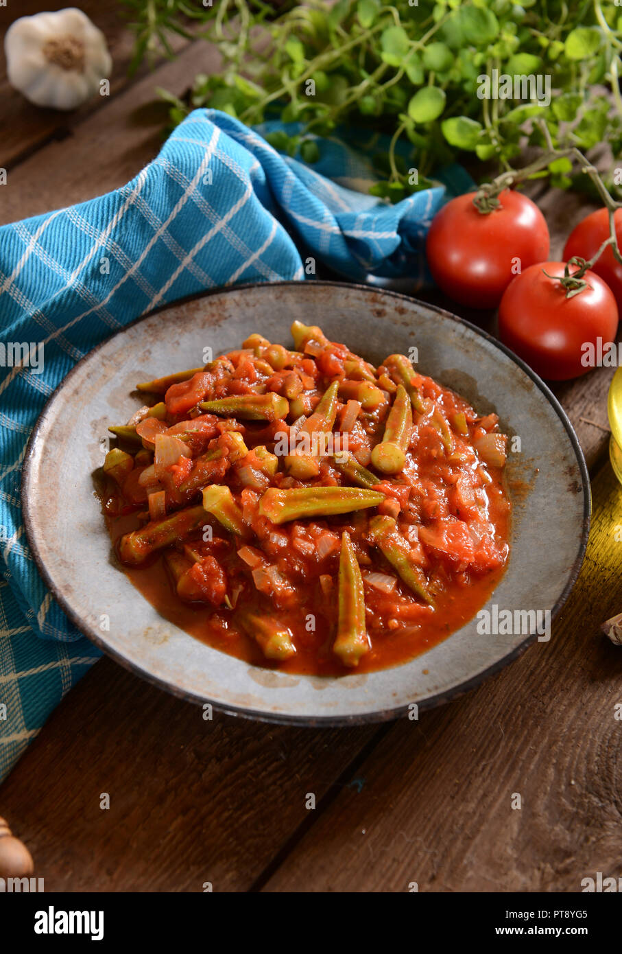 Okra dish with tomatoes (Traditional greek, romanian, bulgarian and ...