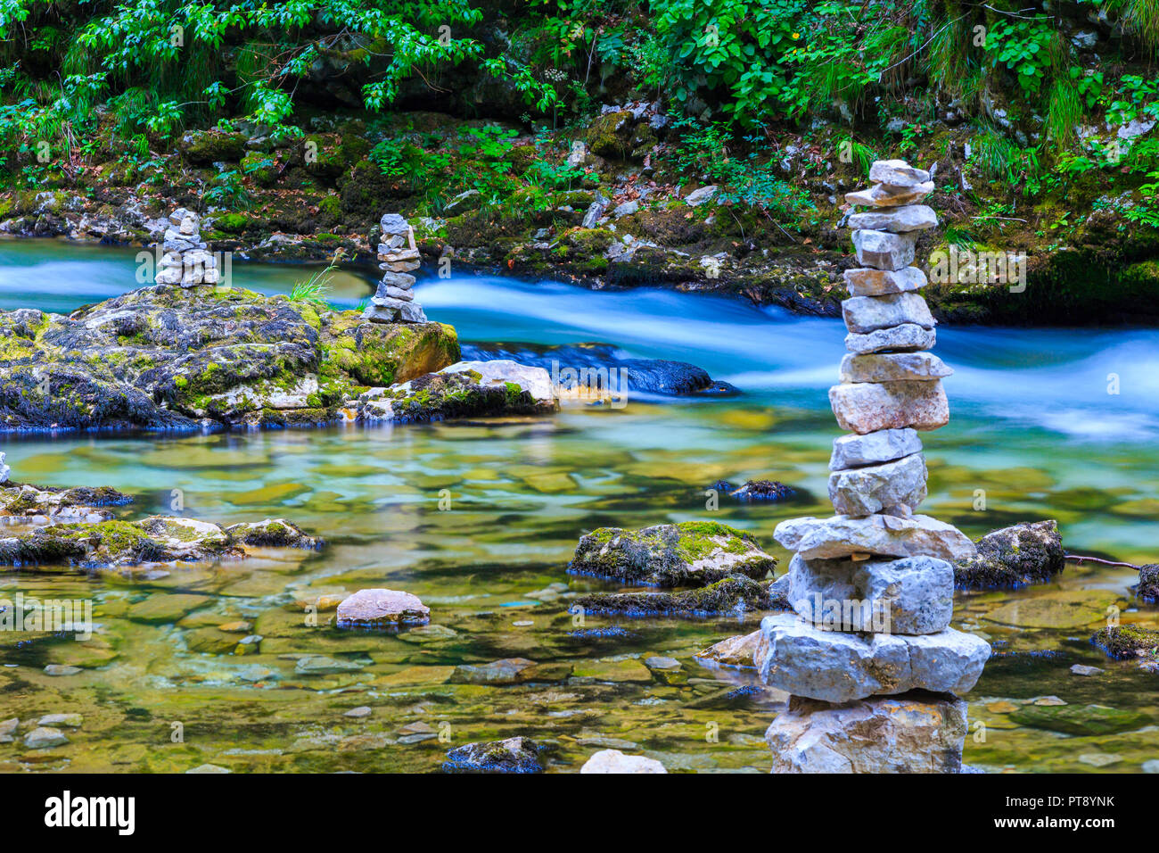 Stone piles in a river Stock Photo - Alamy