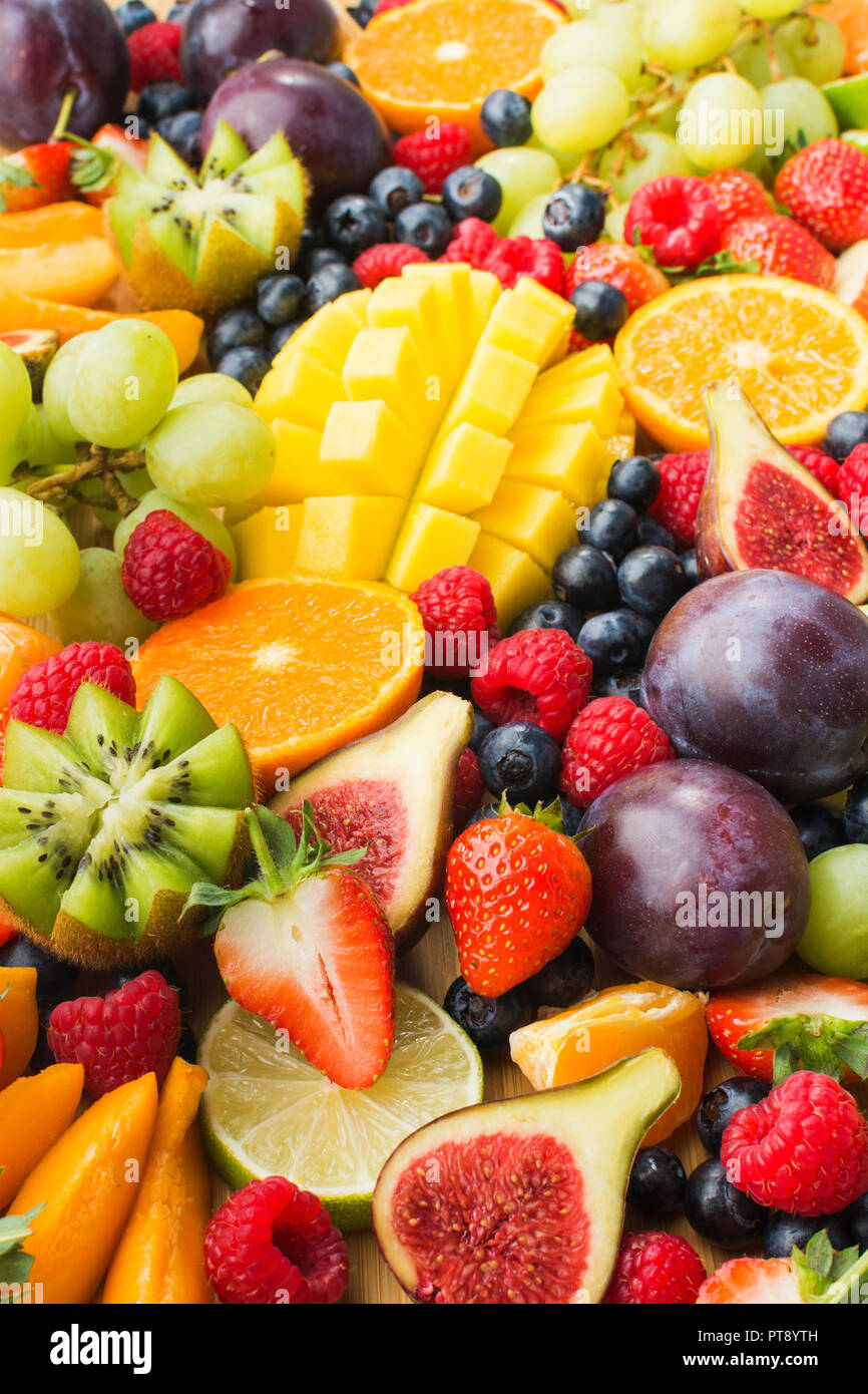 Variety of healthy raw fruits and berries background, strawberries ...