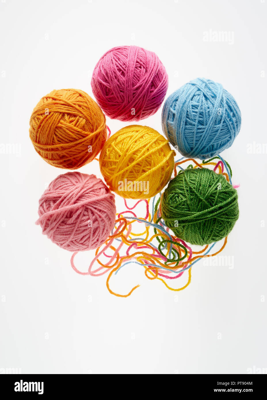 Colorful woolen balls over white background. Balls of wool partially ...