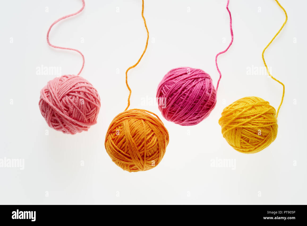 Colorful woolen balls over white background. Balls of wool partially ...