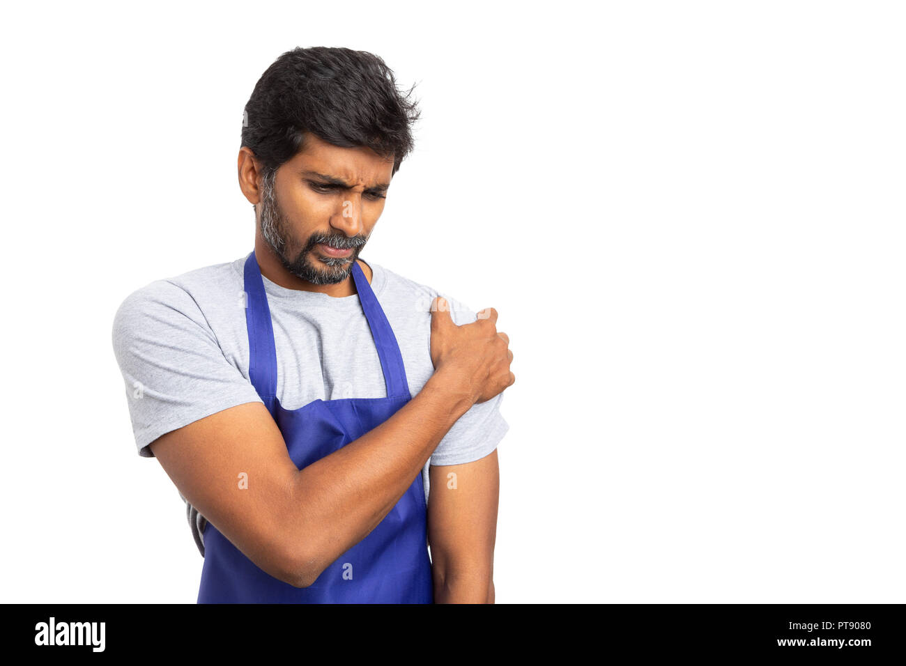 Indian hypermarket or supermarket employee touching injured shoulder ...