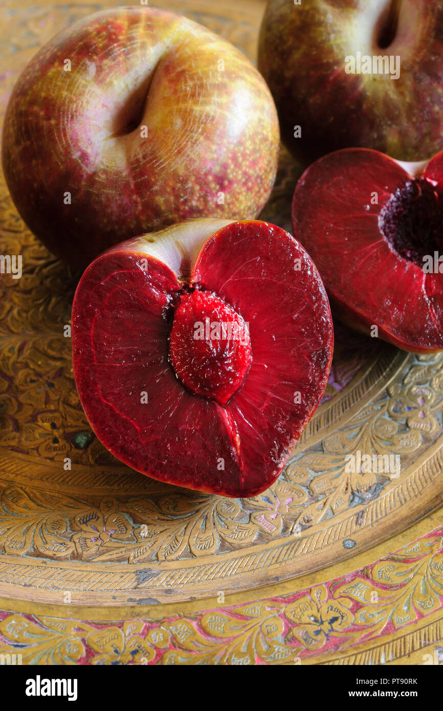 Watermelon plums an unusual variety with red flesh and green skin ...