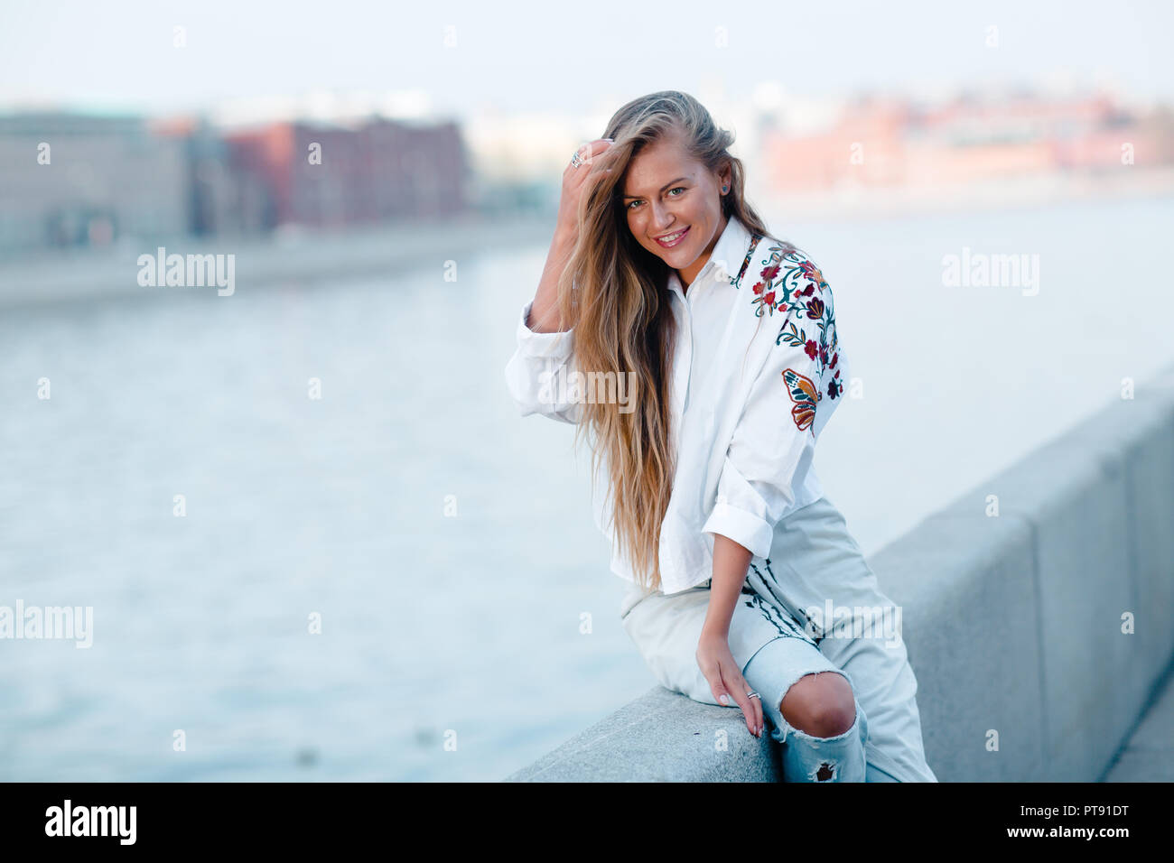 Portrait of a young energetic positive woman at embankment Stock Photo ...