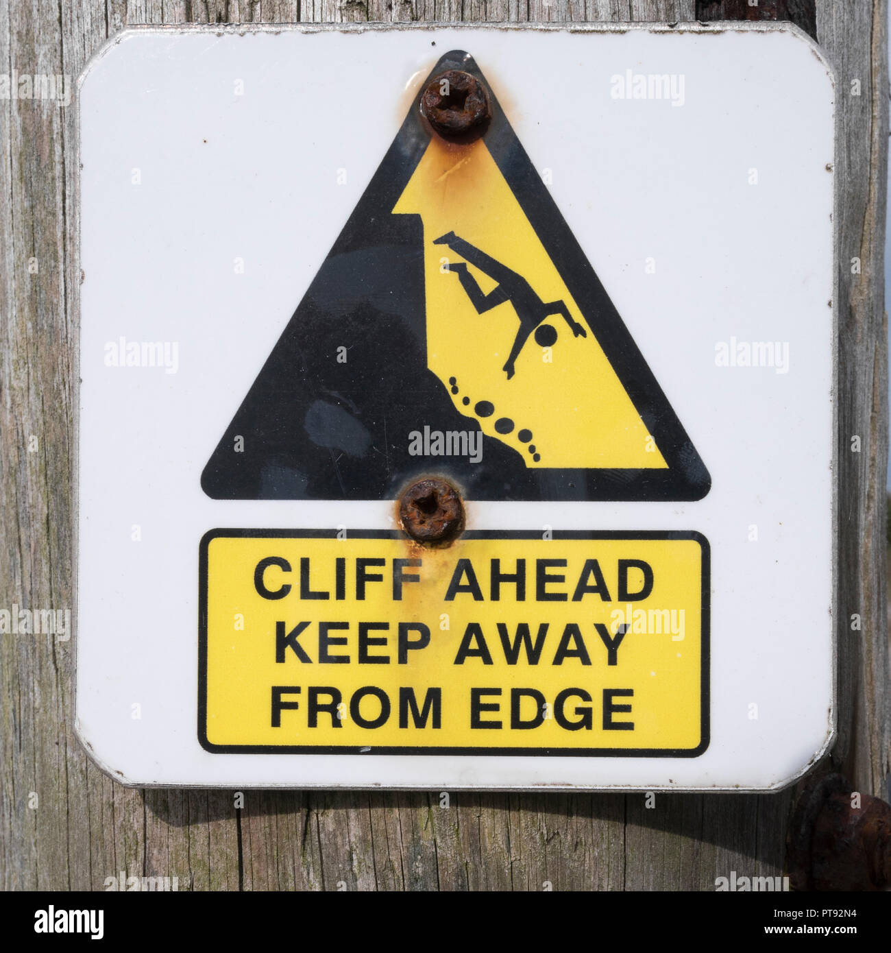 Cliff danger warning sign. Keep away from the cliff edge concept ...