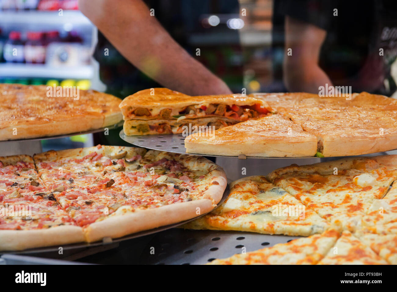 various pizza on a show-window in cafe with various ingredients Stock ...