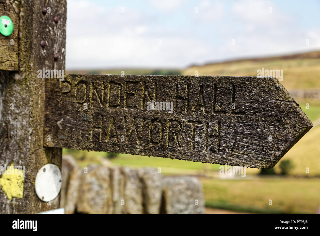 Wooden signpost pointing to Ponden Hall - the building use Emily Bronte ...