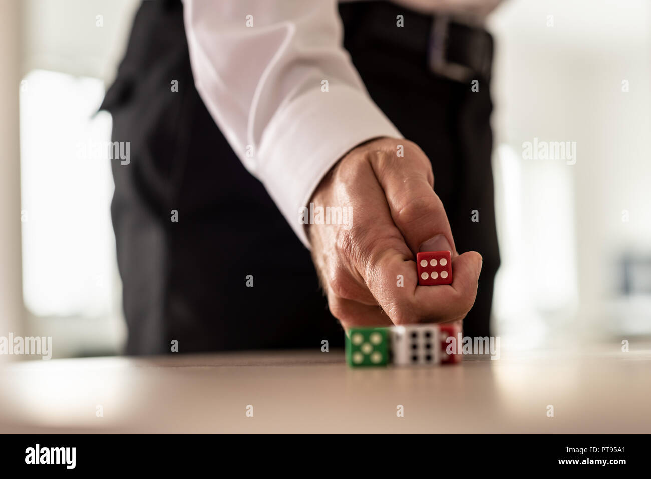 Businessman throwing dice hi-res stock photography and images - Alamy