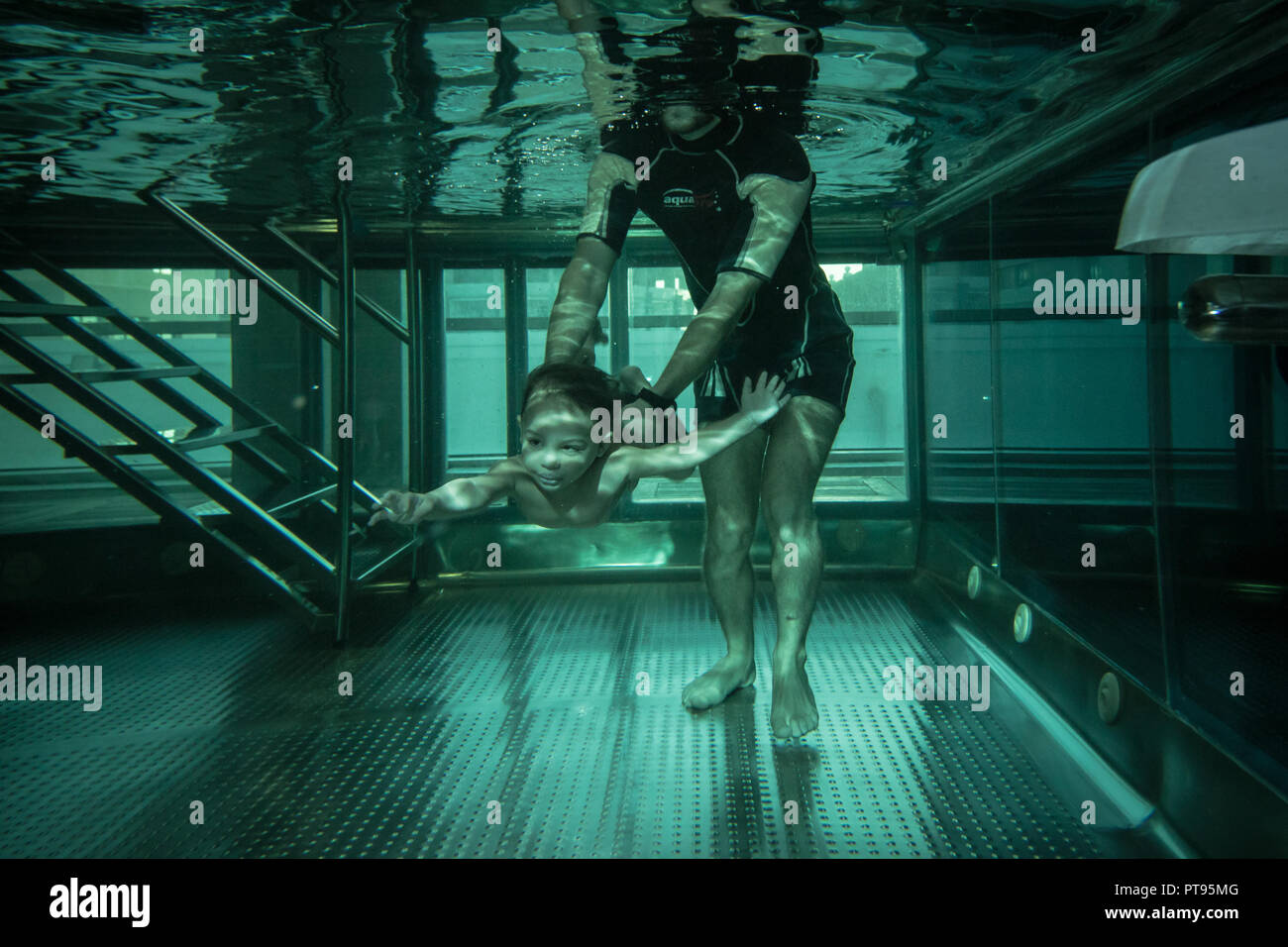 Baby swimming underwater hi-res stock photography and images - Alamy