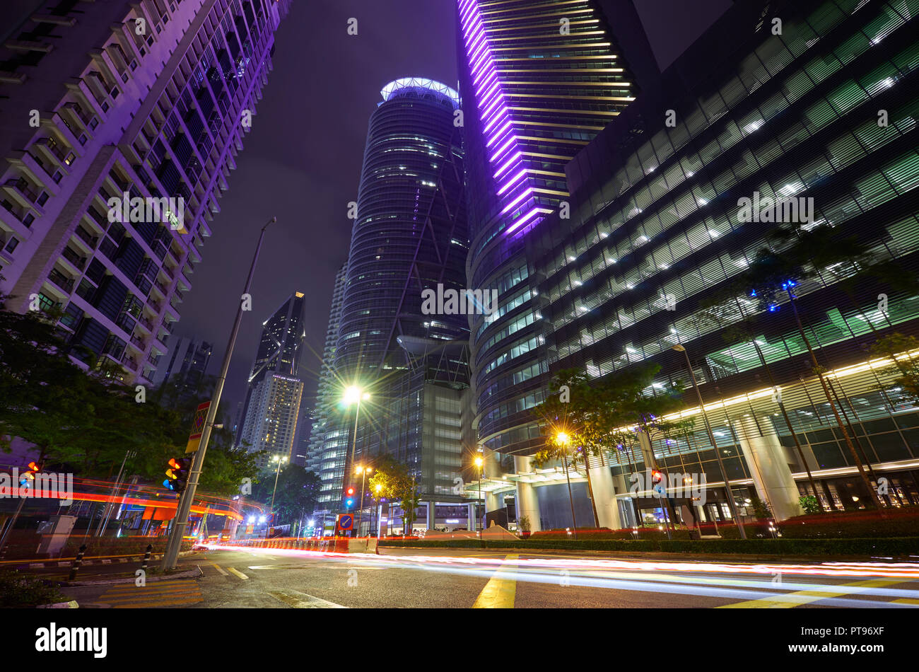 Modern building with light trails on night scene background Stock Photo ...