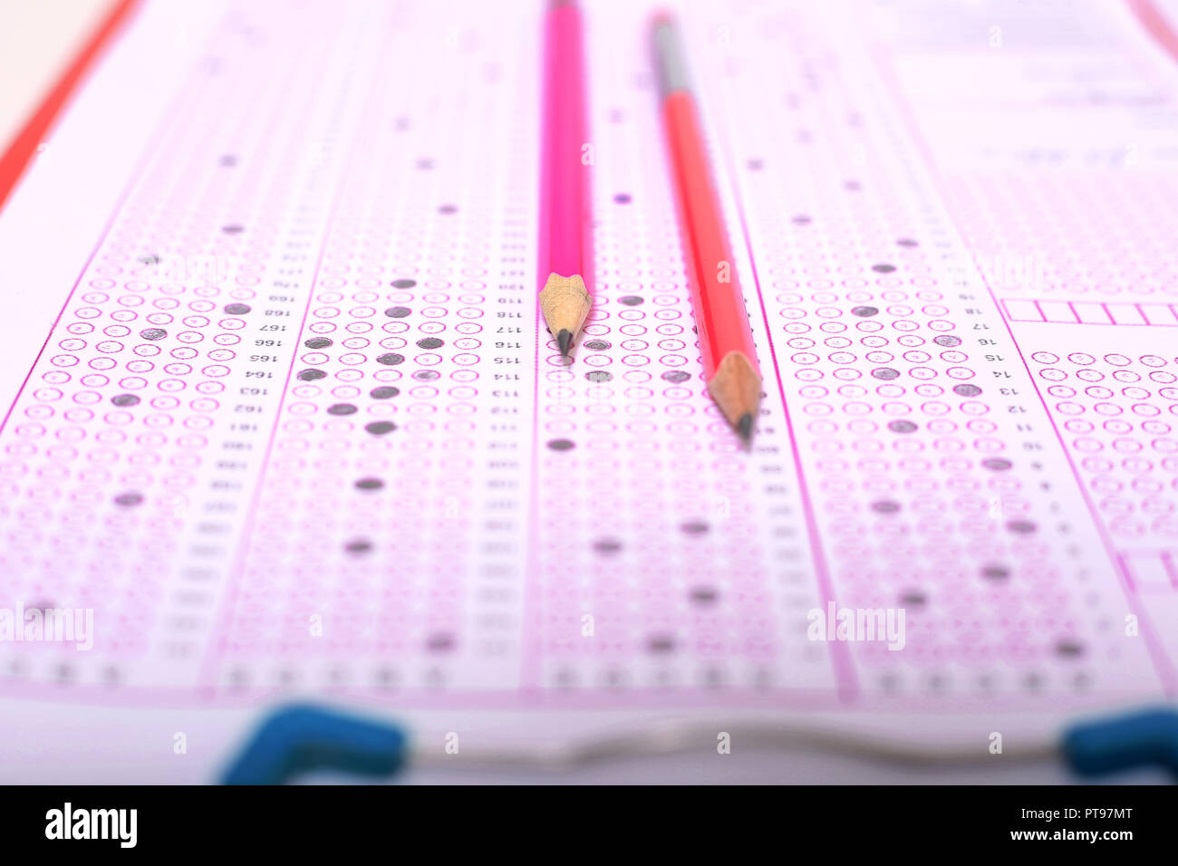 Picture of two pencil on the OMR sheet and OMR sheet on the clipboard ...