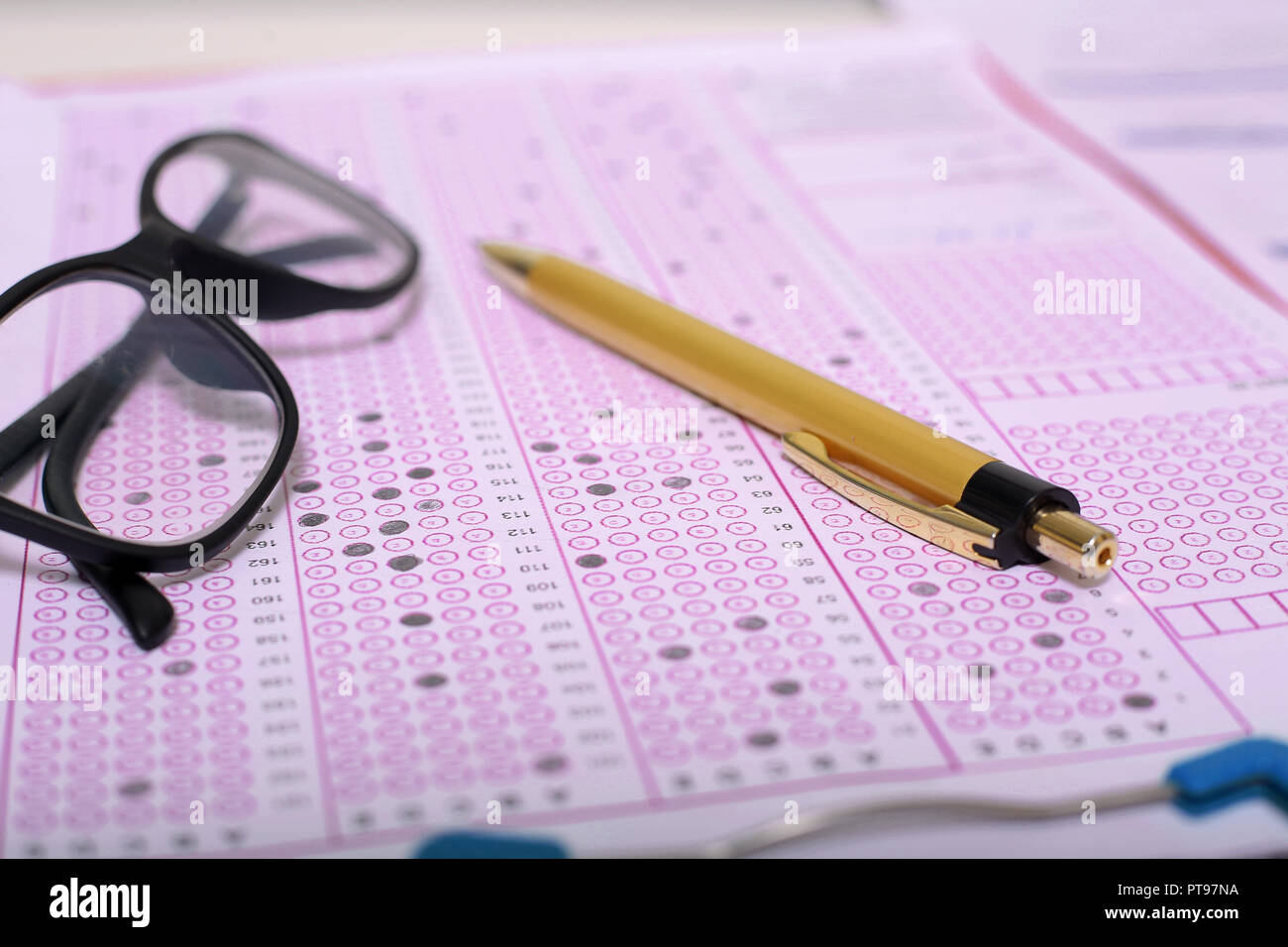 Picture of clipboard, OMR sheet, pen and glasses Stock Photo - Alamy